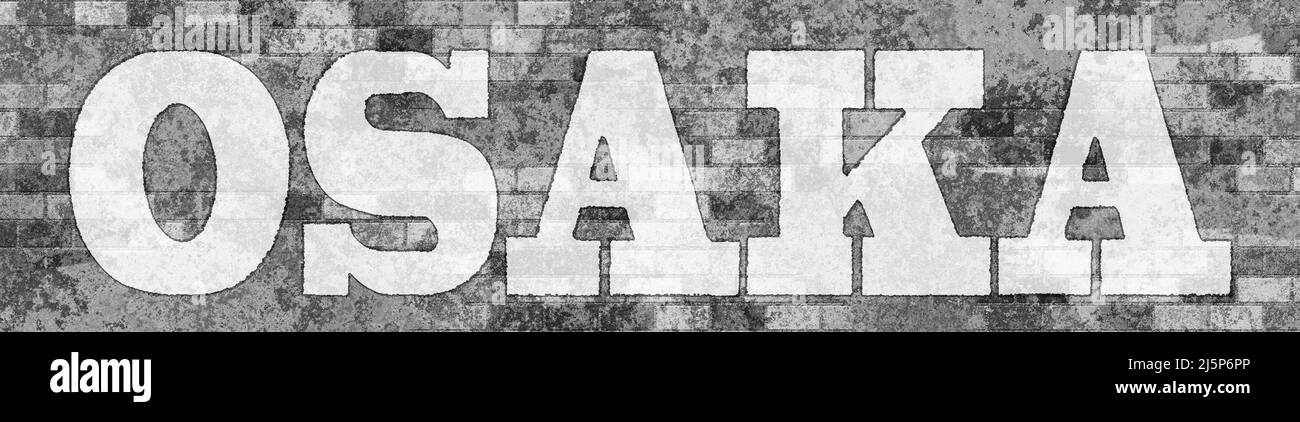 White lettering on a gray brick wall with the name of the city OSAKA ...