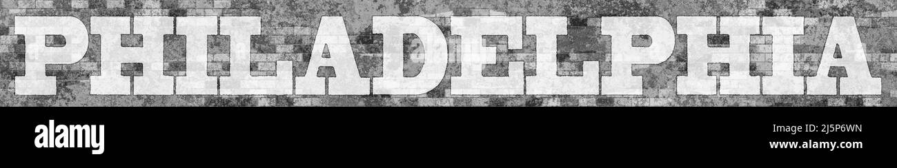 White lettering on a gray brick wall with the name of the city ...