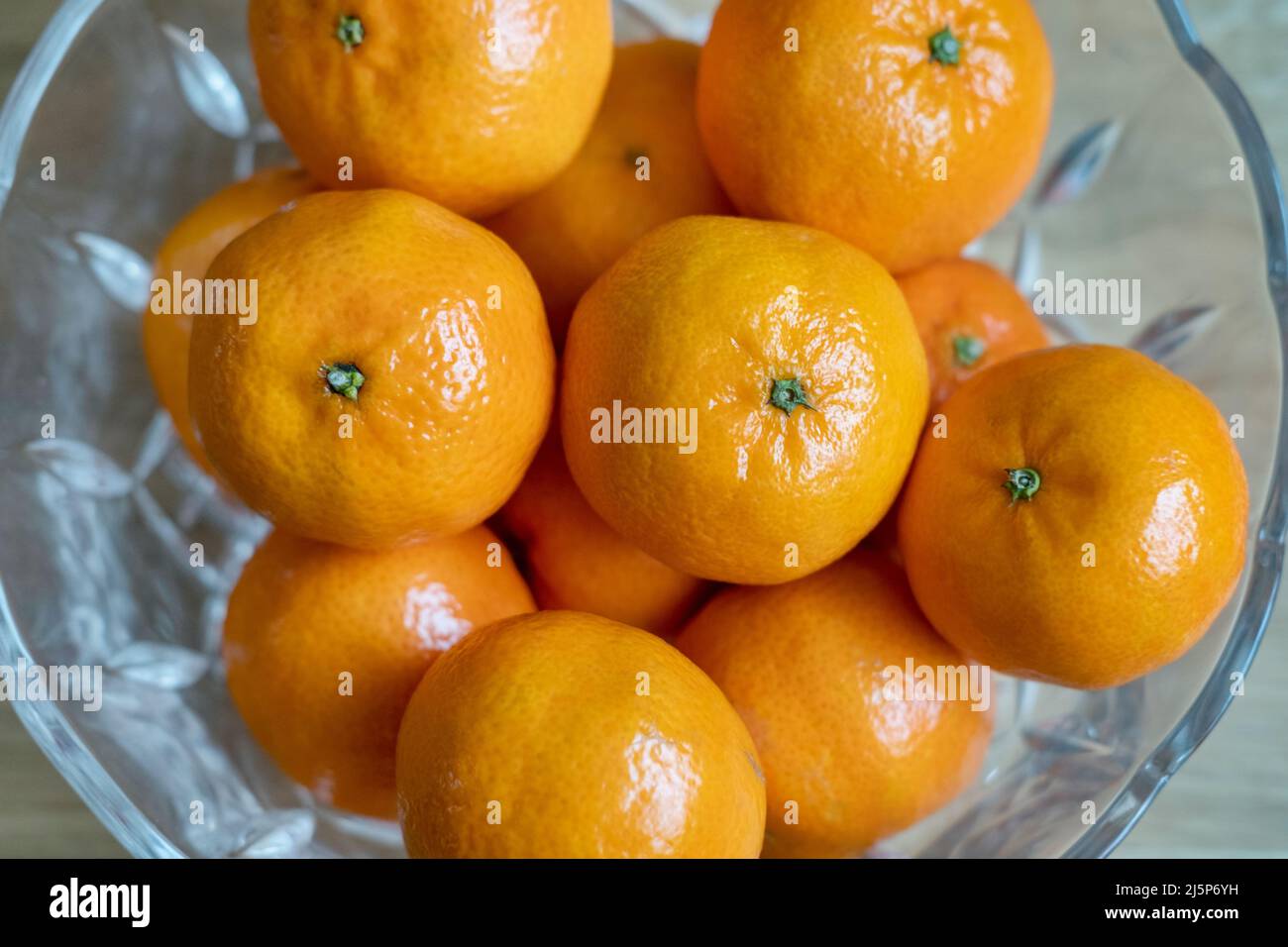 Fresh mandarin oranges also known as Citrus reticulata placed in a ...