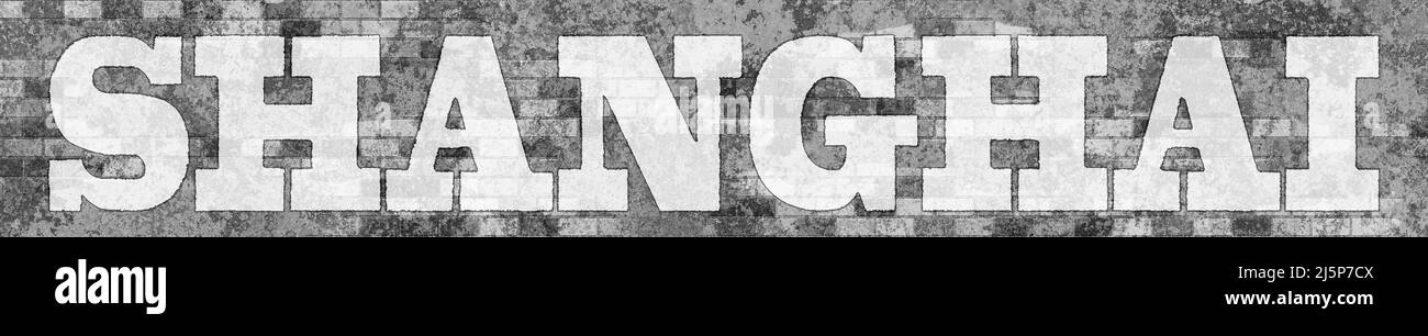 White lettering on a gray brick wall with the name of the city SHANGHAI ...