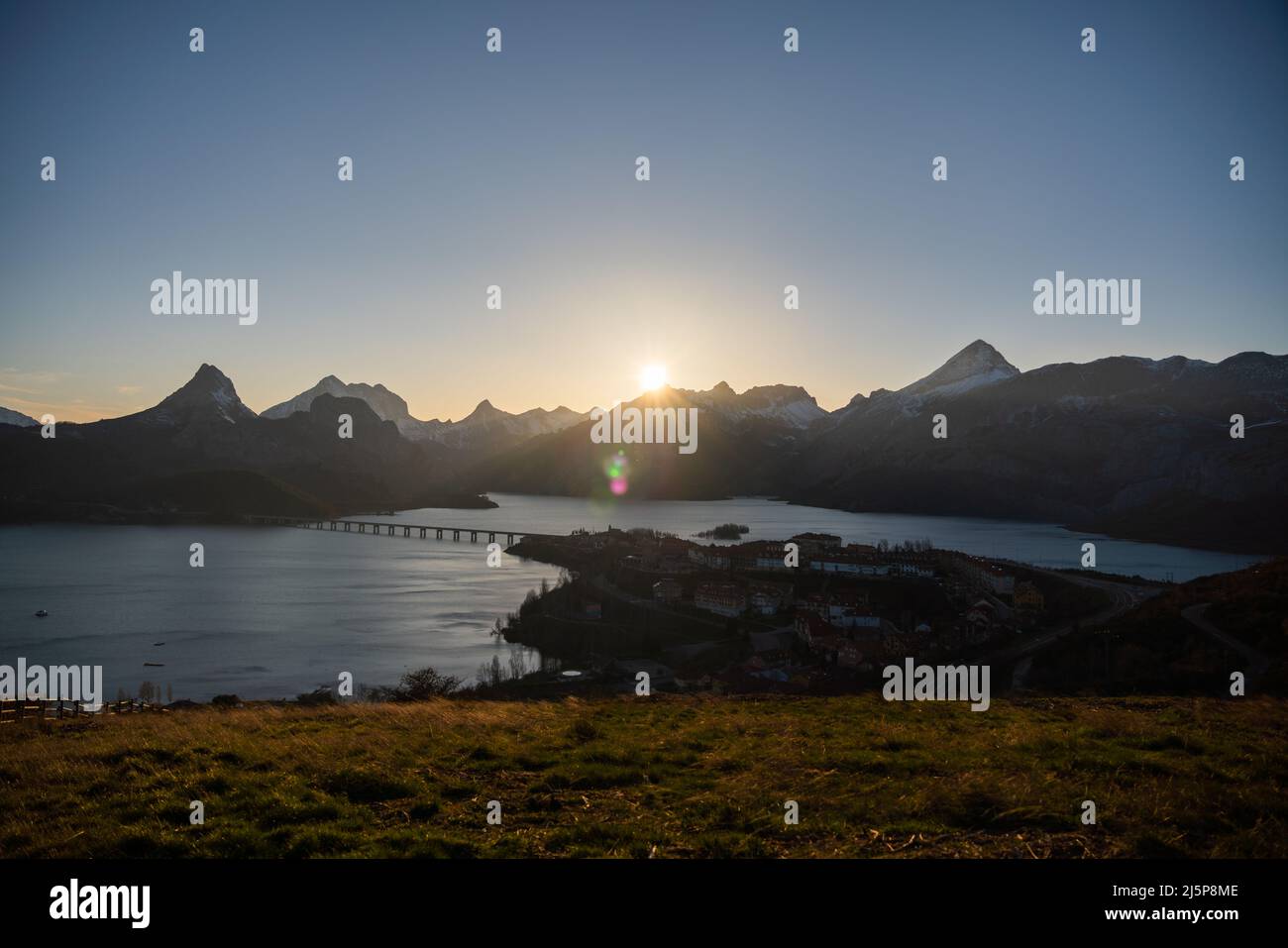View of riaño, Spain and its mountains at sunset Stock Photo - Alamy