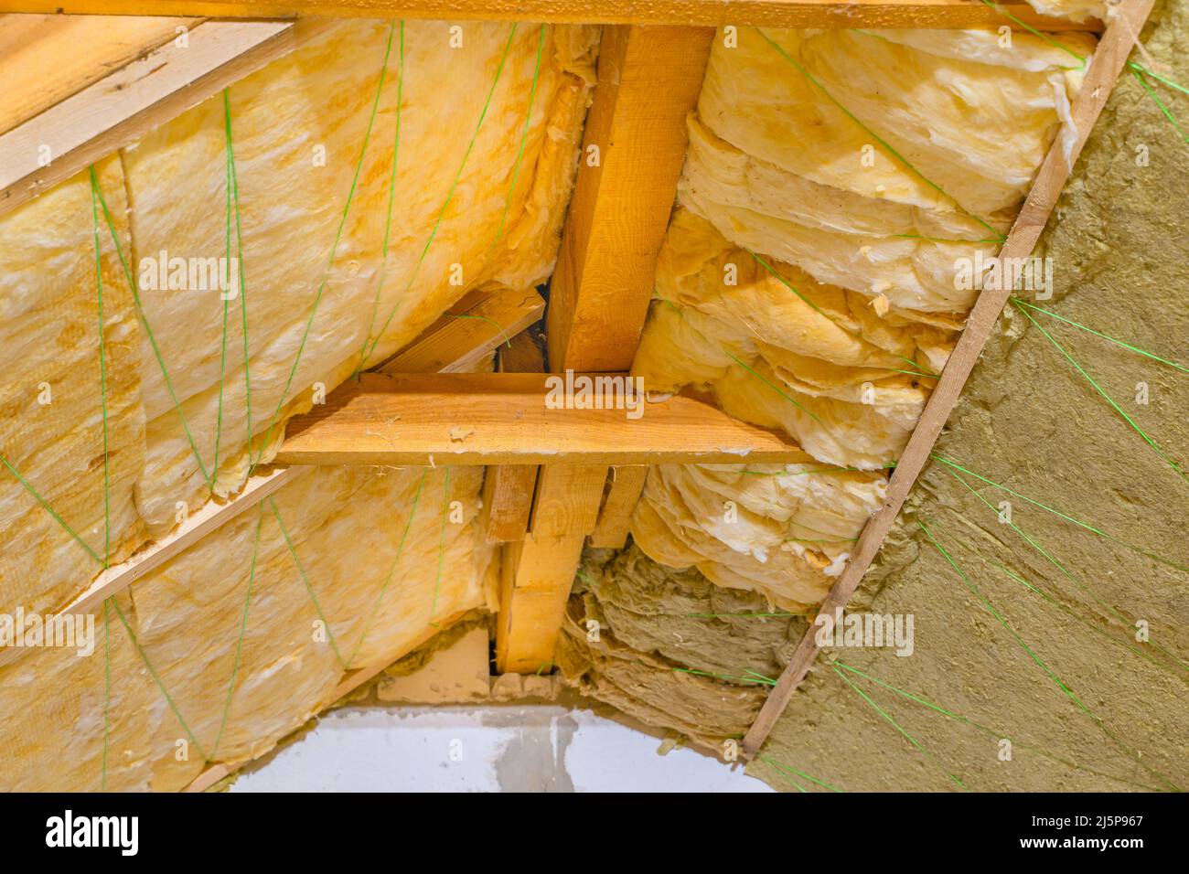 Hemming roof insulation with polypropylene thread Stock Photo - Alamy