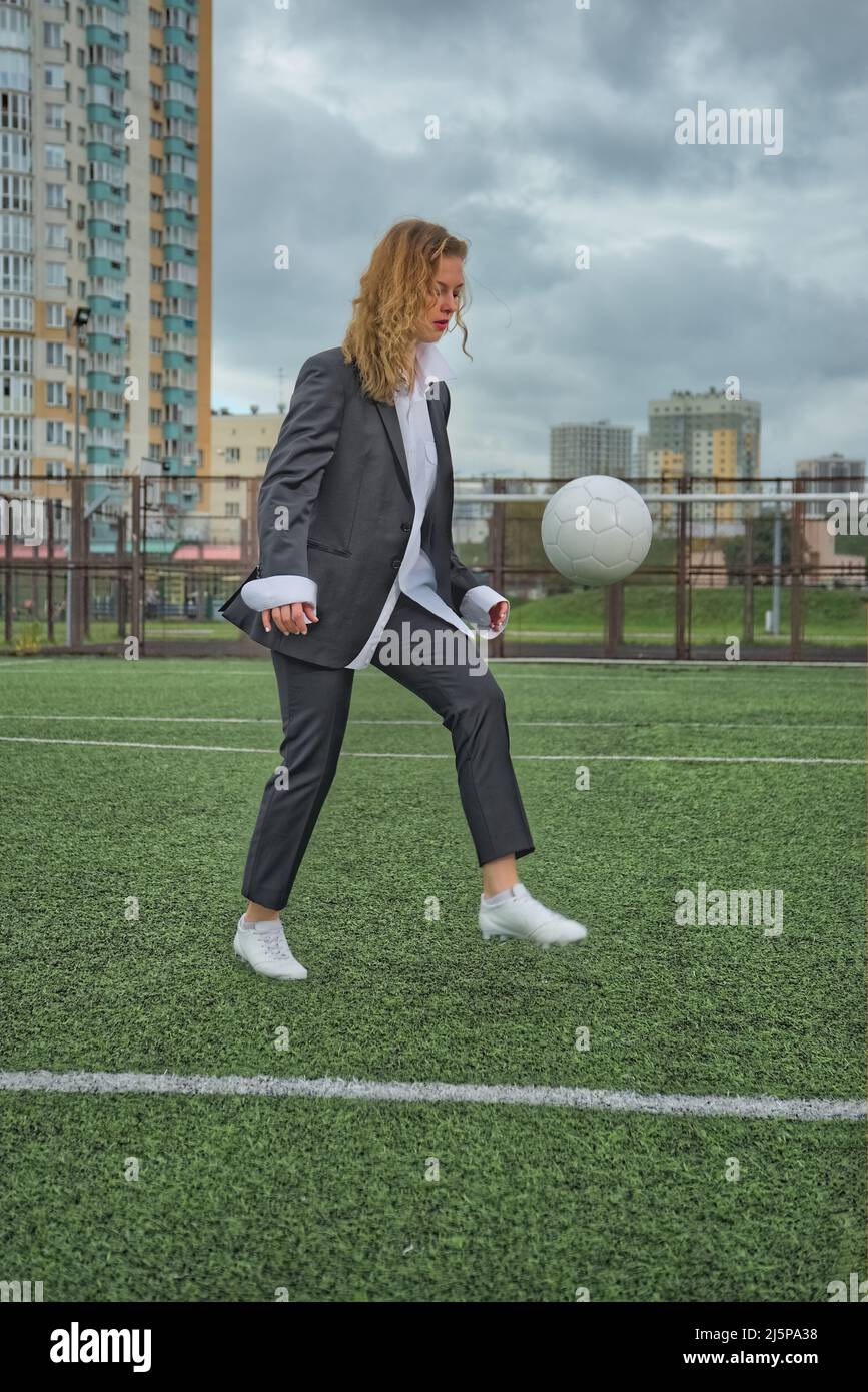woman soccer player with ball on the field. ball dribbling, feint Stock ...