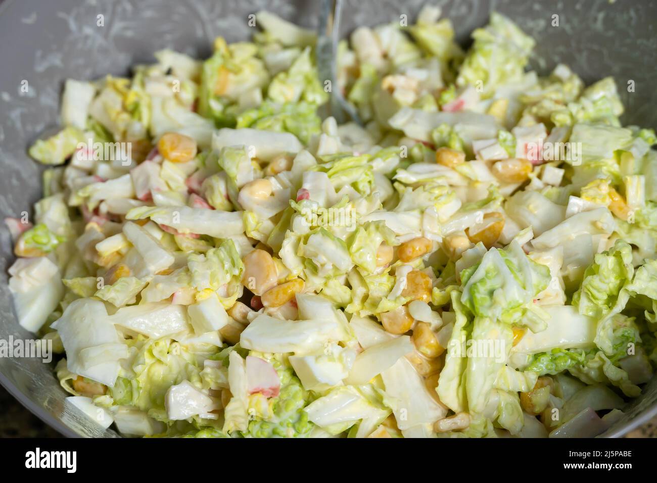 Close-up salad of peking cabbage, corn, crab meat Stock Photo - Alamy