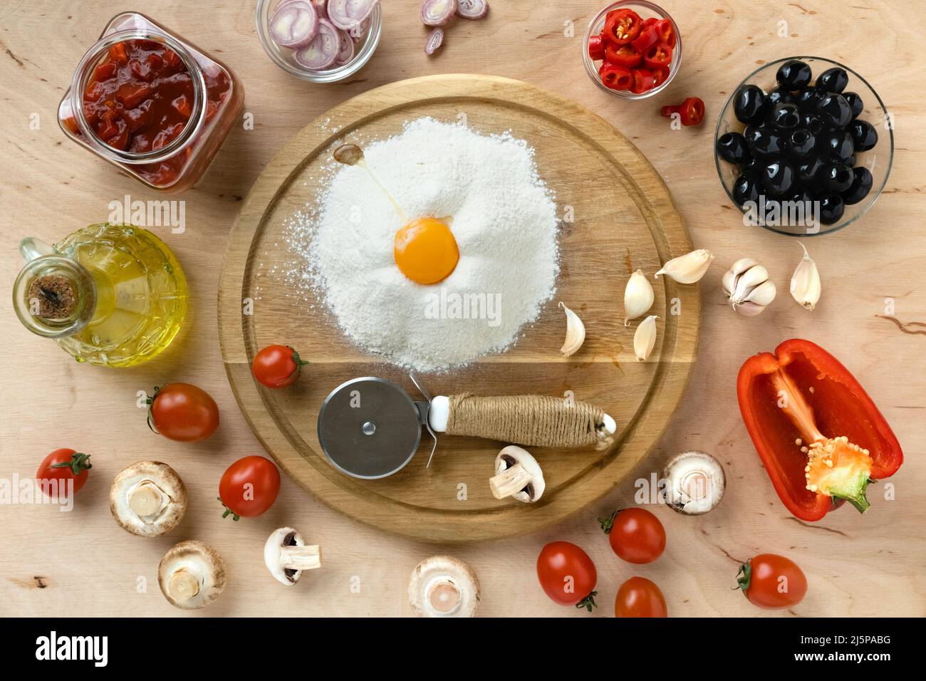 Ingredients for cooking italian pizza on a wooden table, top view ...