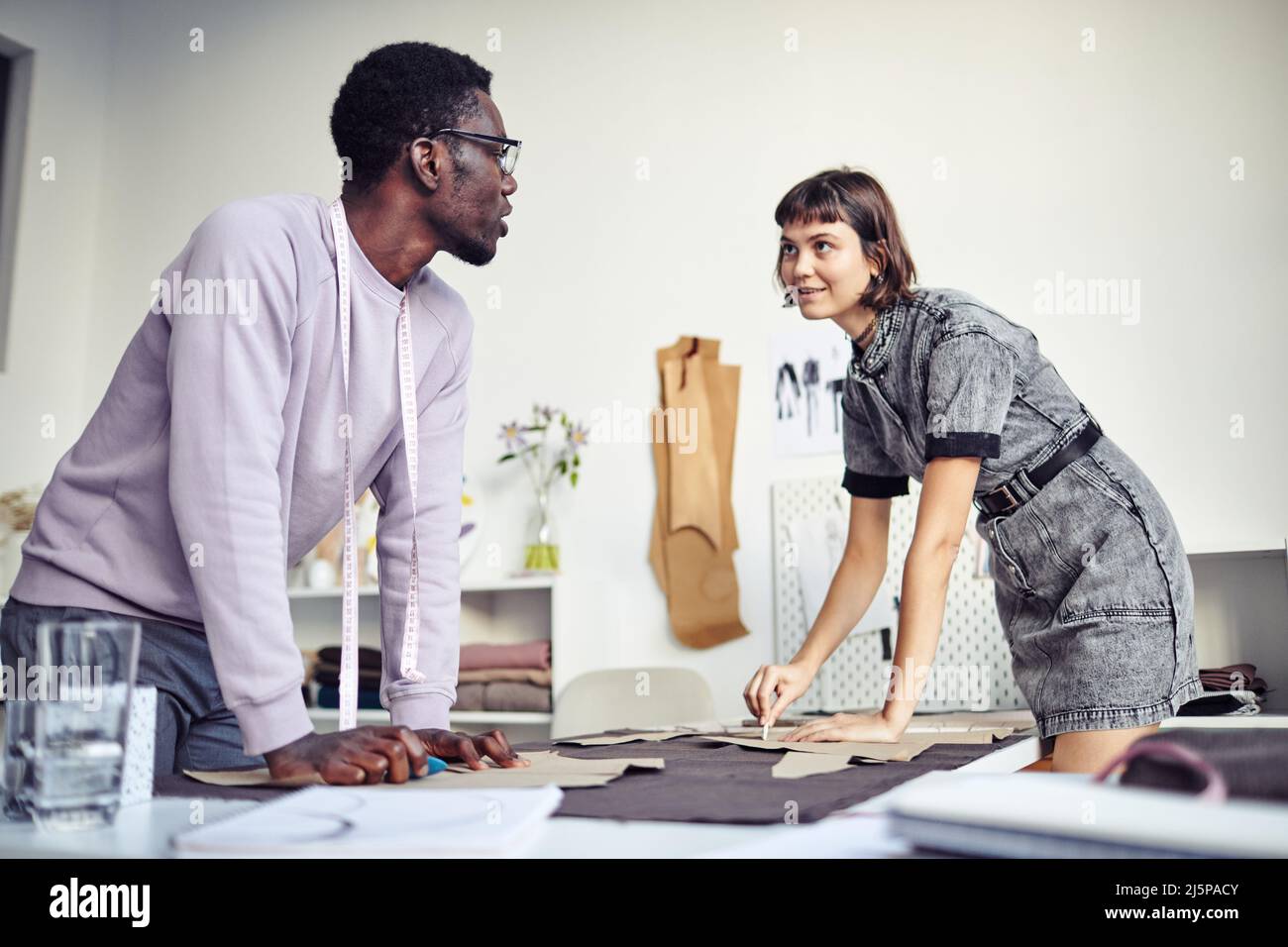 Fashion design students learning tailoring in classroom, they are ...