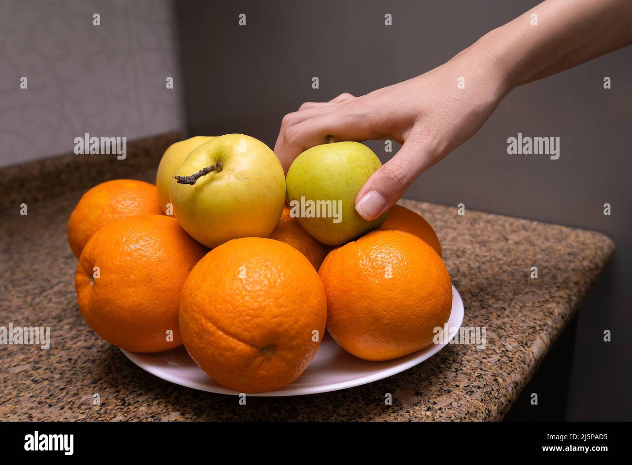 Hand take red apples from hi-res stock photography and images - Alamy