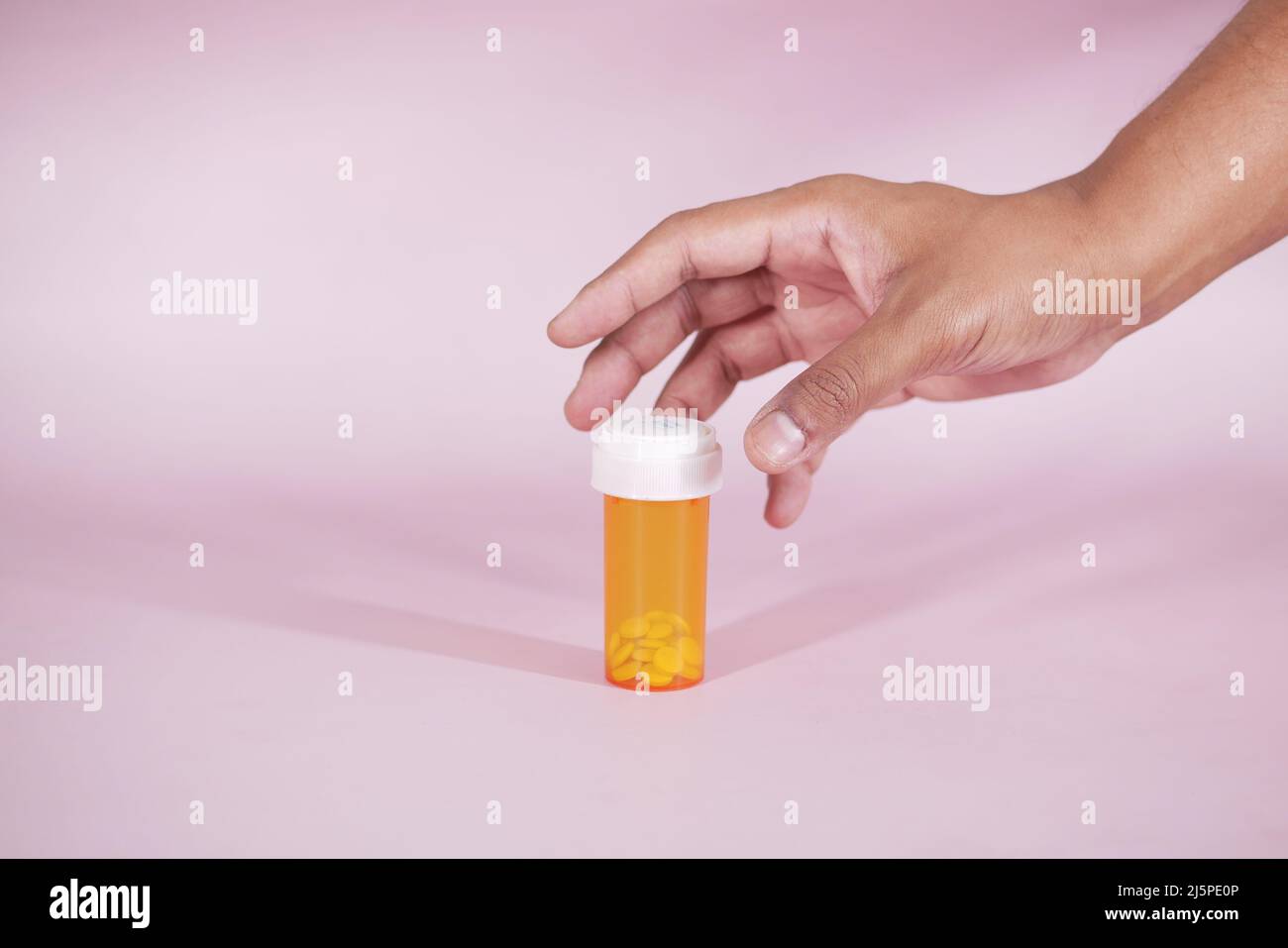 Hand picking up pills hi-res stock photography and images - Alamy