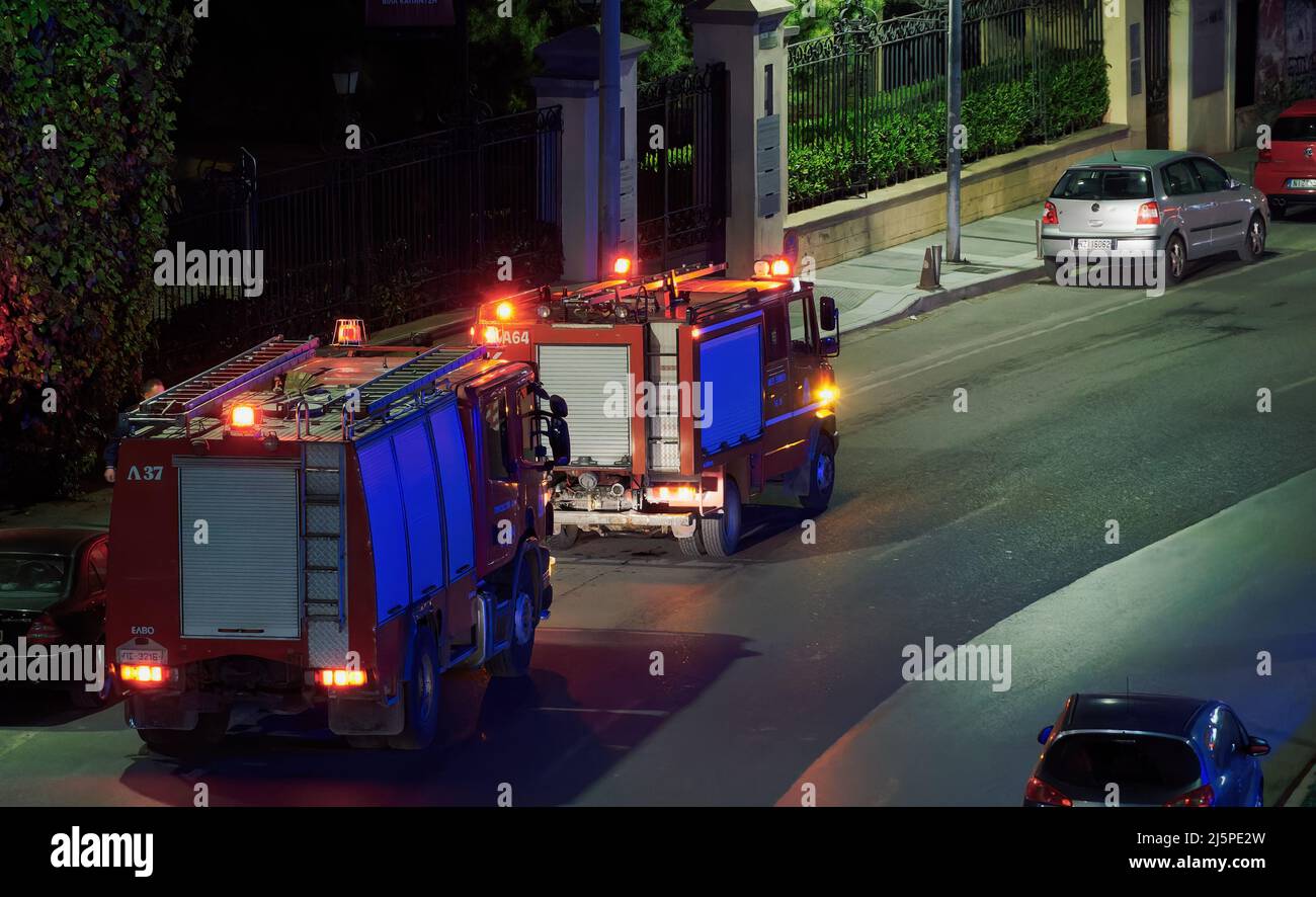 Greek Fire Brigade Service trucks with firefighters in uniform during a ...