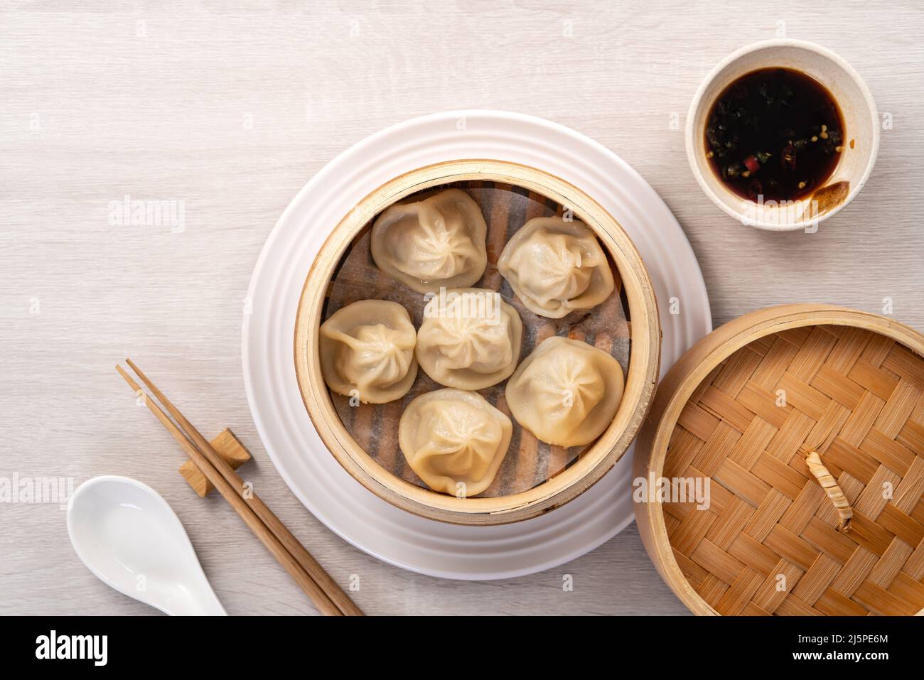 Eating steamed pork soup dumplings named Xiao long bao xiaolongbao in ...
