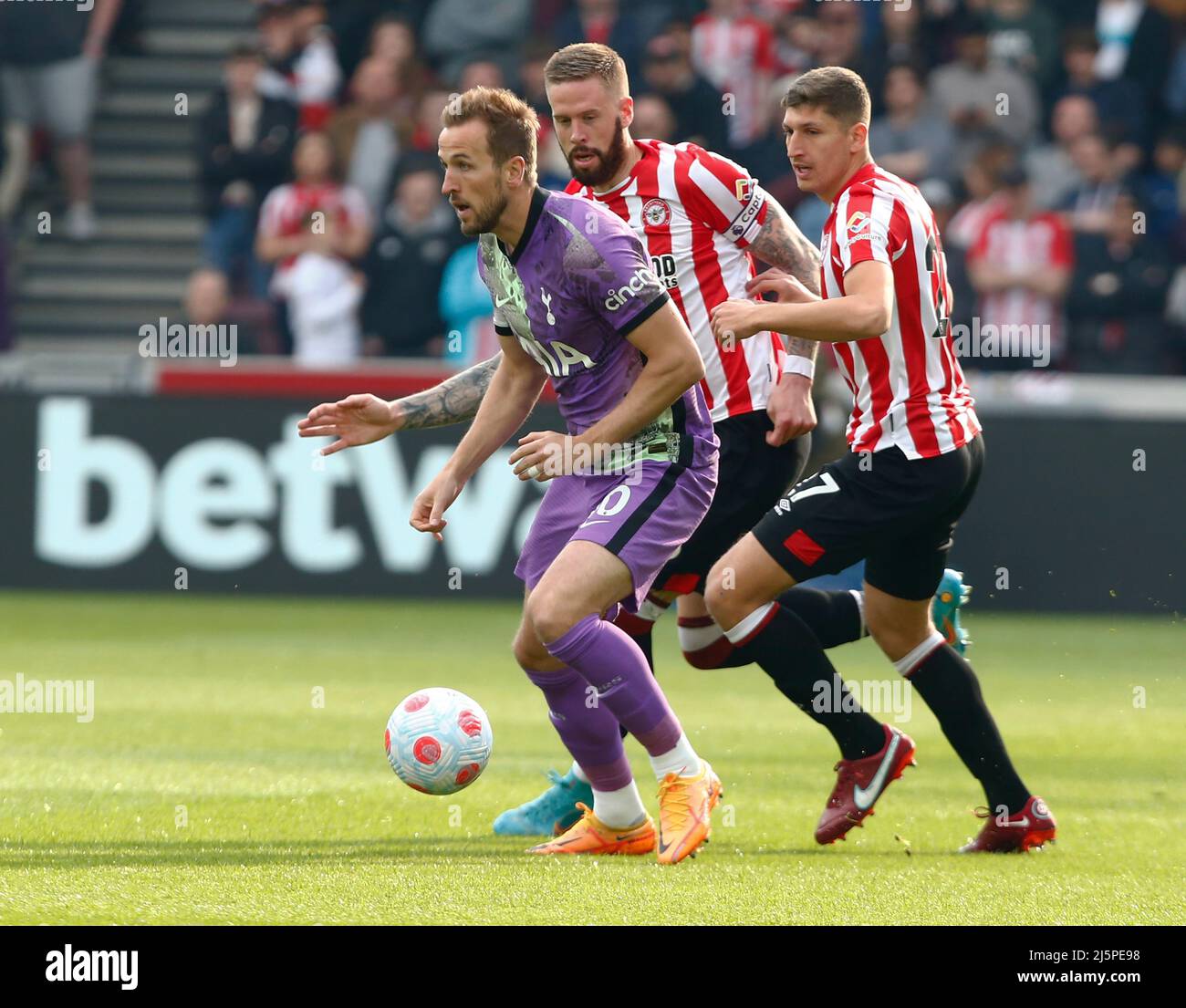 London, England - APRIL 23: Tottenham Hotspur's Harry Kane holds of Pontus Jansson of Brentford ...