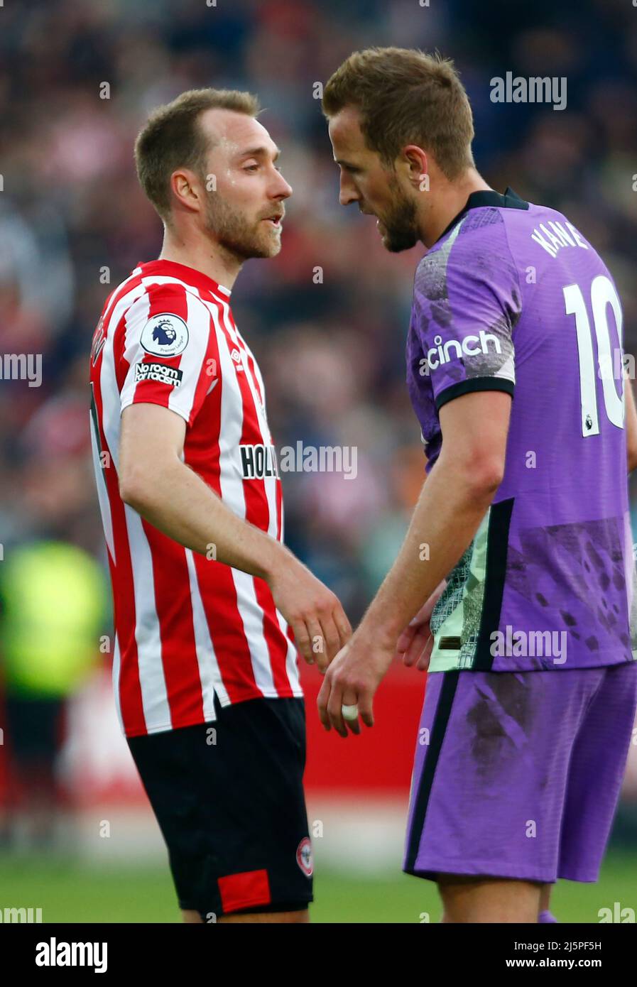London, England - APRIL 23: L-R Christian Eriksen of Brentford shanks ...