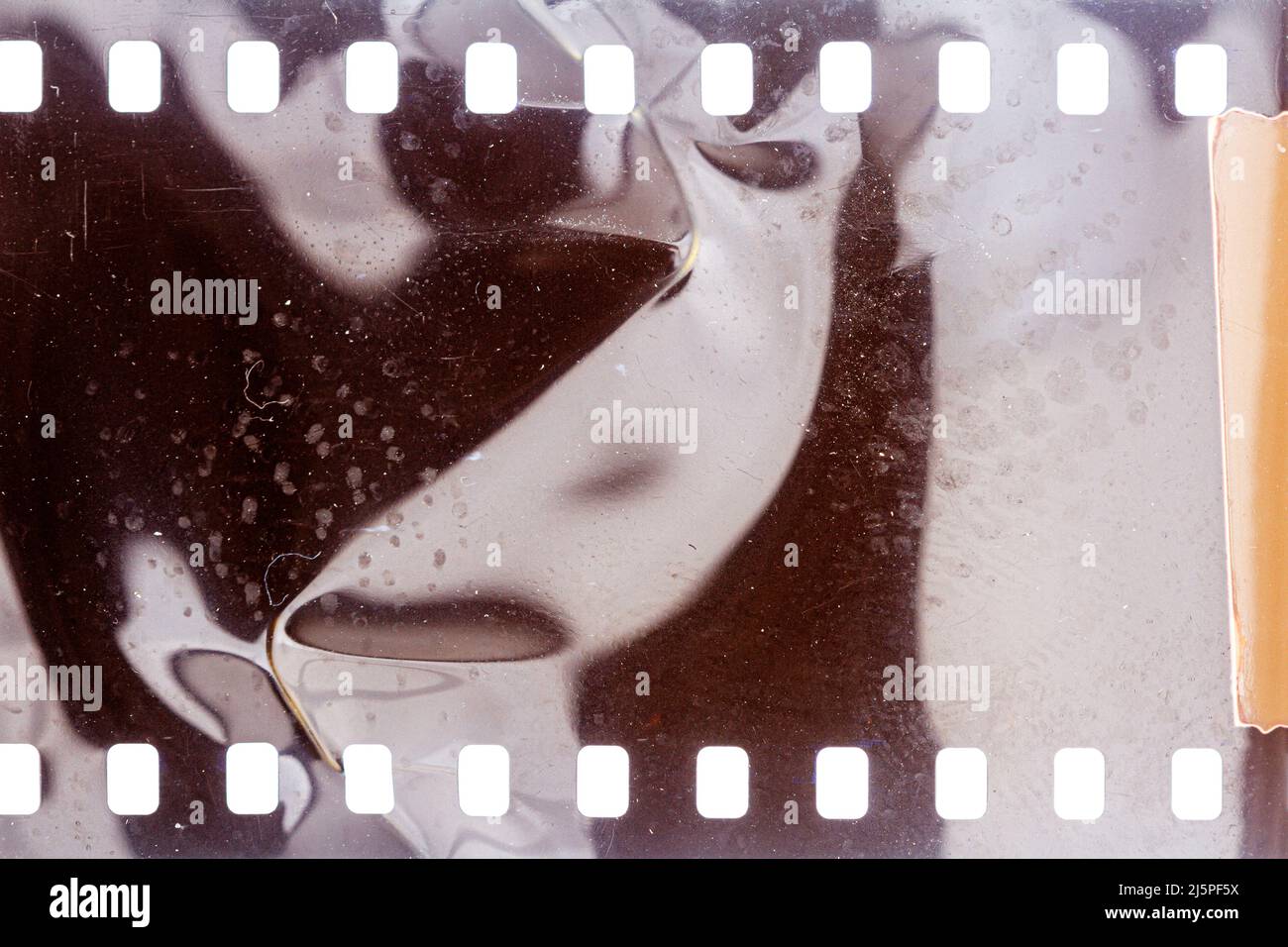 Dusty and grungy 35mm film texture or surface. Perforated scratched ...