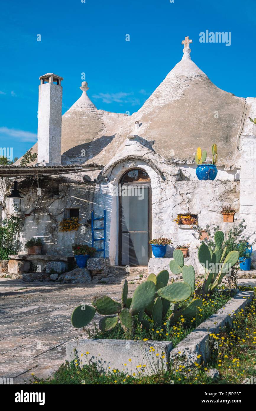 Group of beautiful Trulli or Trullo house, traditional Apulian dry ...