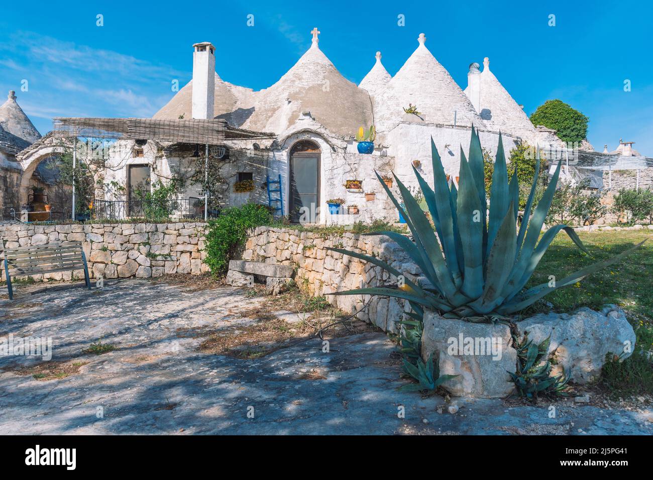 Group of beautiful Trulli or Trullo house, traditional Apulian dry ...