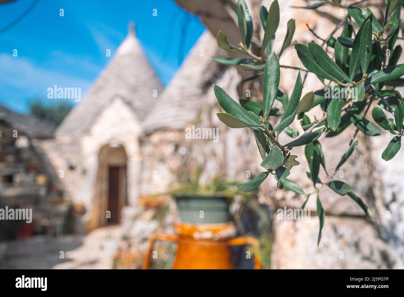 Group of beautiful Trulli or Trullo house, traditional Apulian dry ...