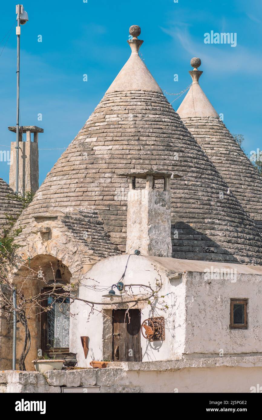Group of beautiful Trulli or Trullo house, traditional Apulian dry ...