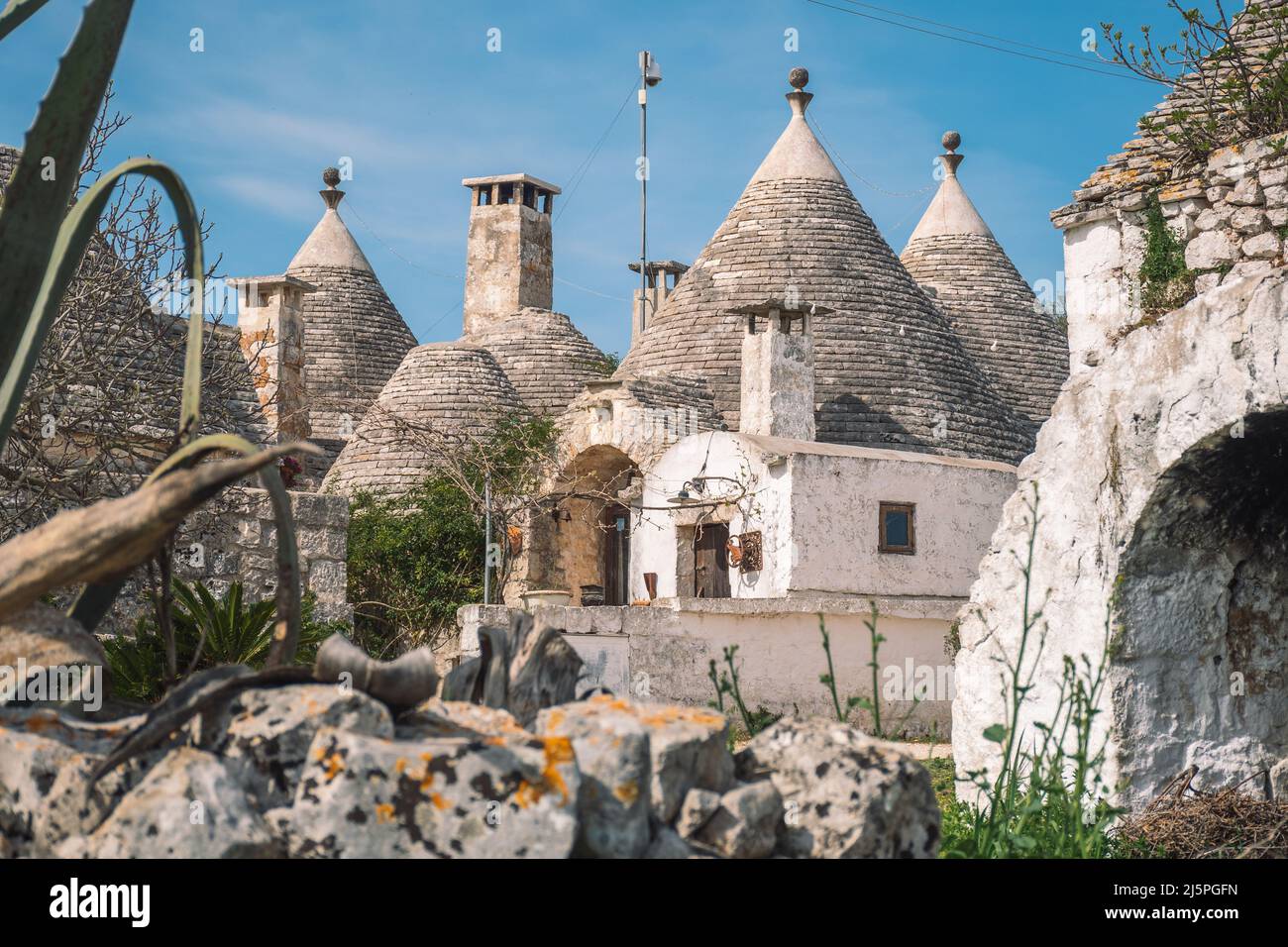 Group of Trulli or Trullo house, traditional Apulian dry stone hut with ...