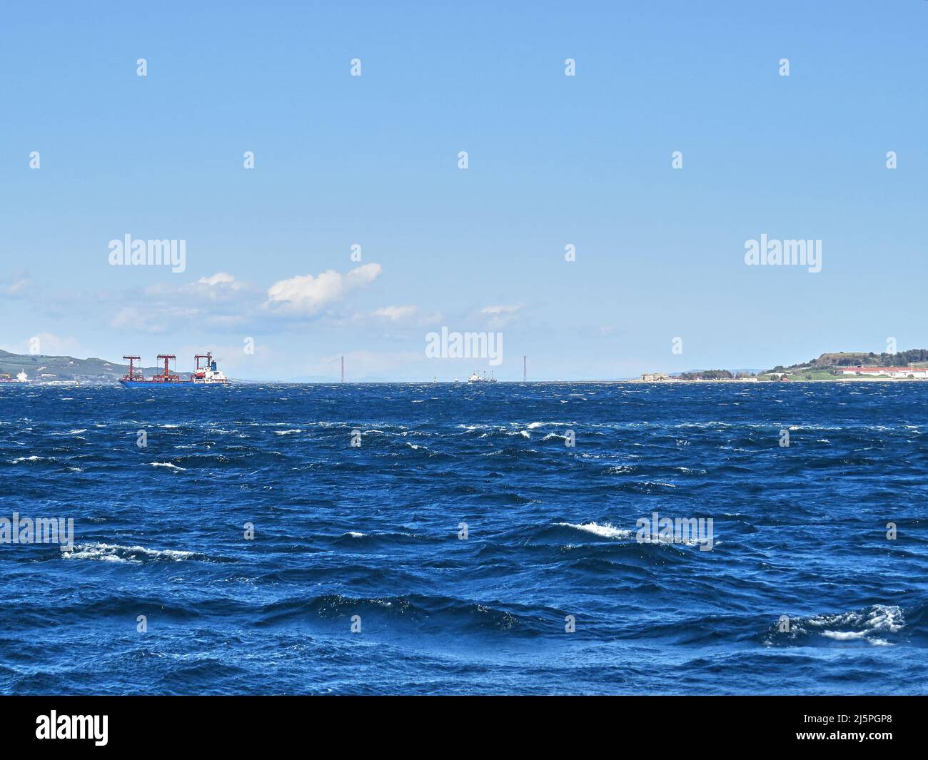 Cargo ship crossing the strait , 1915 Canakkale Bridge in background ...