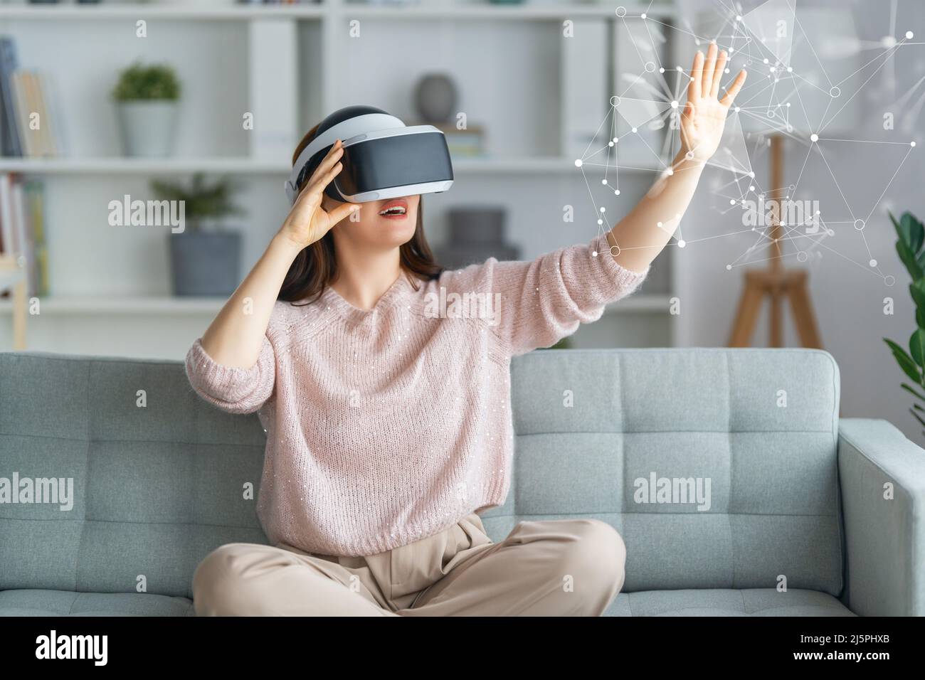 Metaverse technology concept. Woman with VR virtual reality goggles ...
