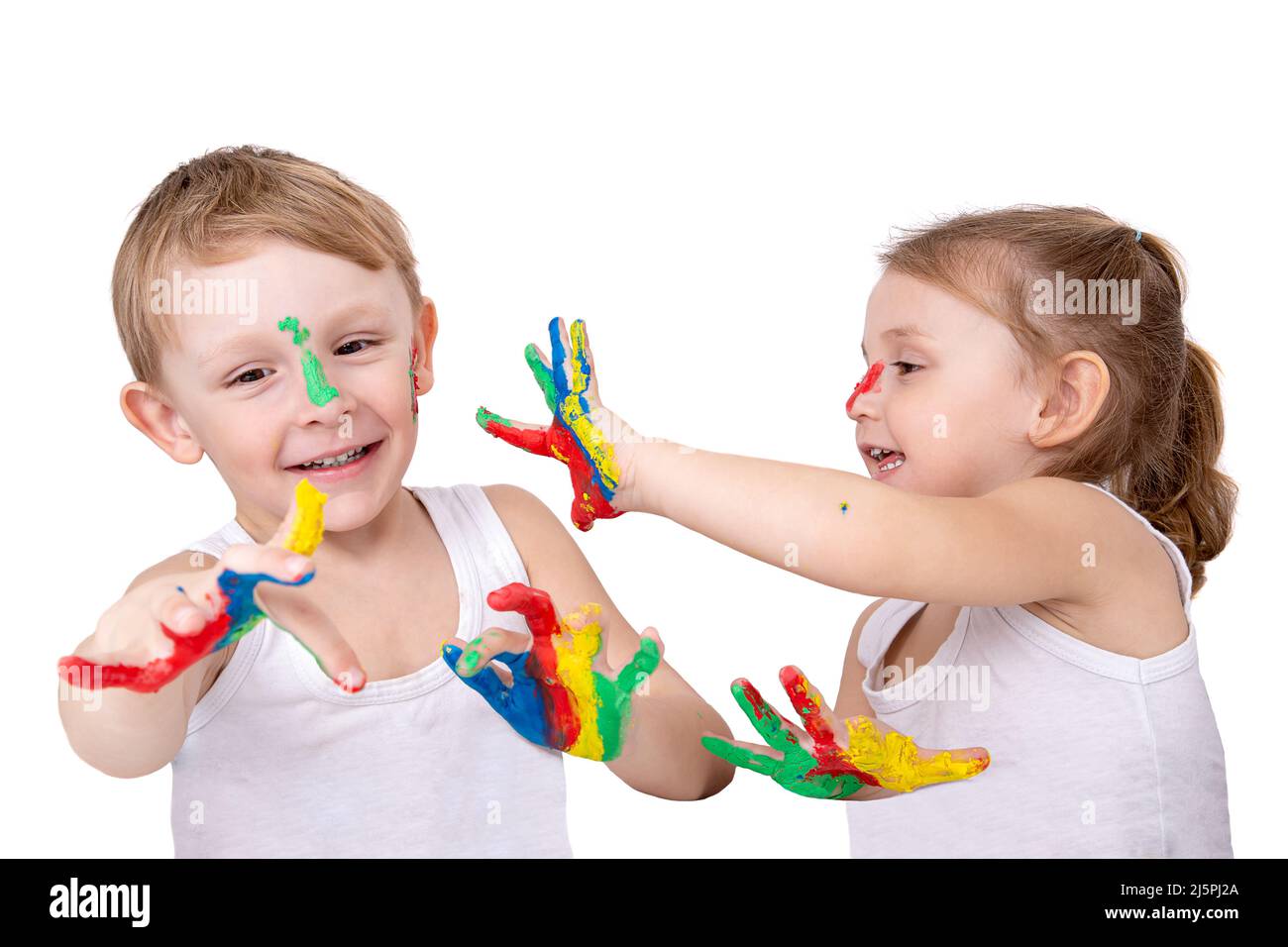 Small children draw on each other with finger paints, on a white ...