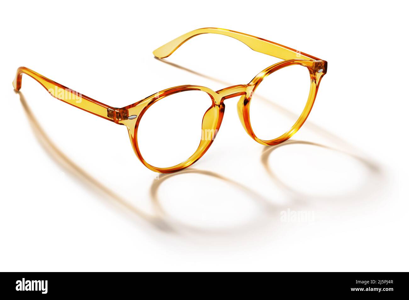 Eyeglasses in orange golden bright color in transparent plastic ...