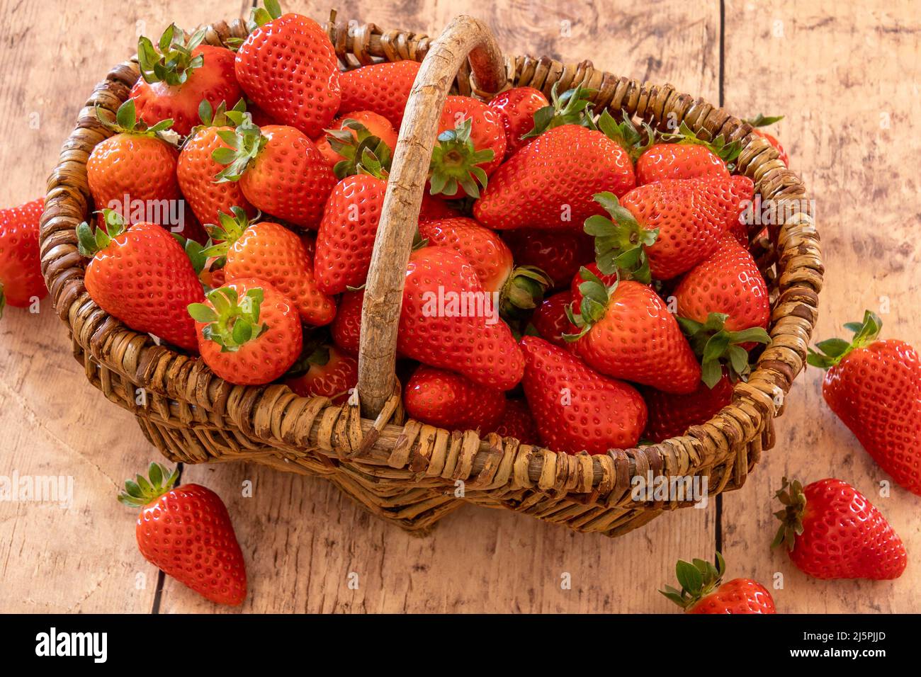 top view of ripe strawberries in a basket Stock Photo - Alamy