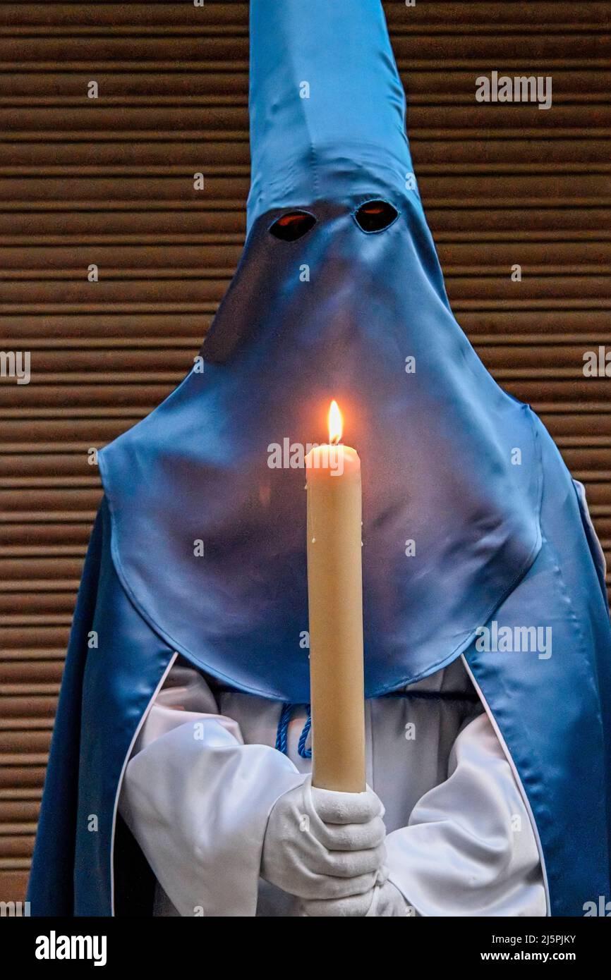 Penitent with a candle, in the procession in Holy Week Stock Photo - Alamy