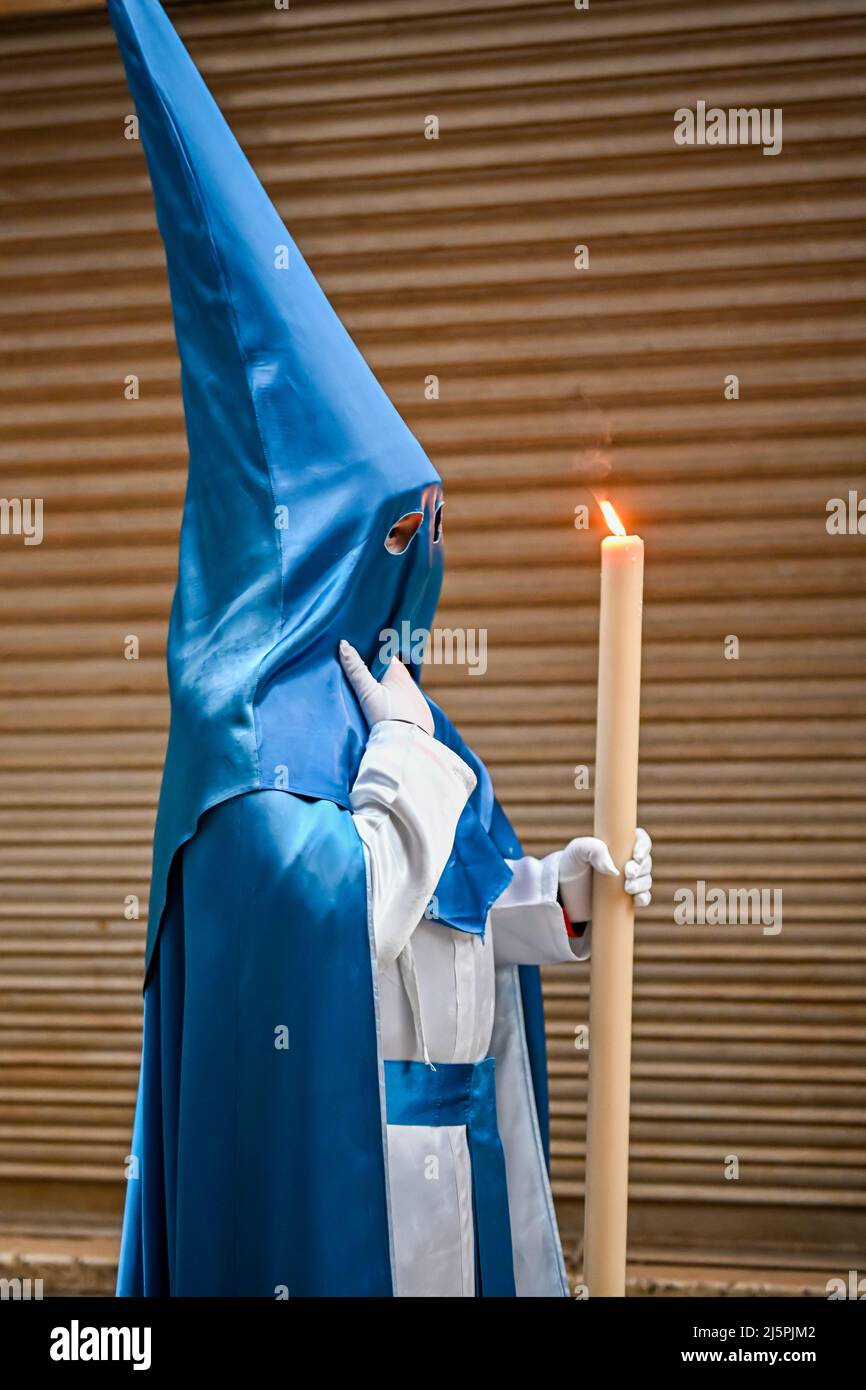 Penitent with a candle, in the procession in Holy Week Stock Photo - Alamy