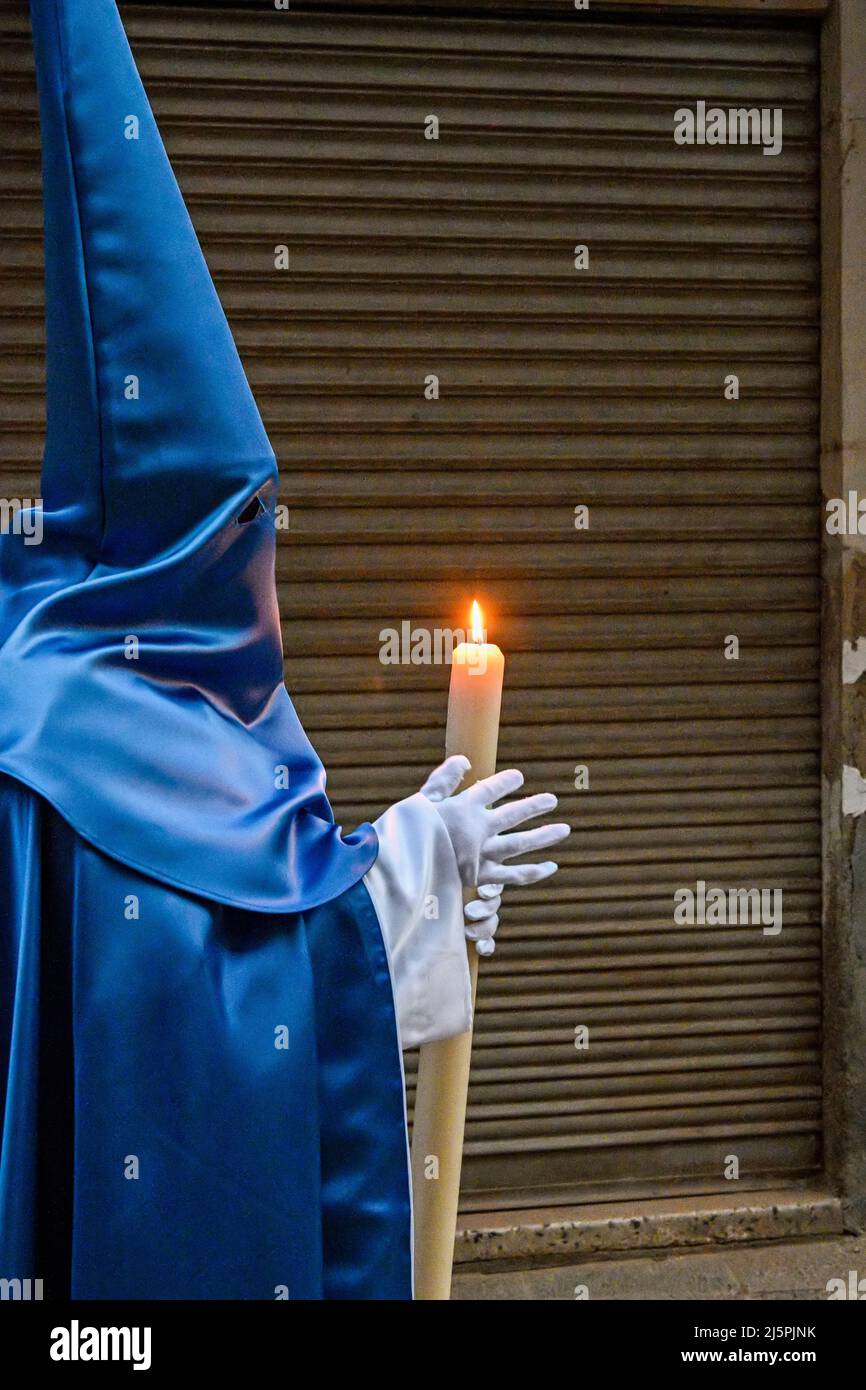 Penitent with a candle, in the procession in Holy Week Stock Photo - Alamy