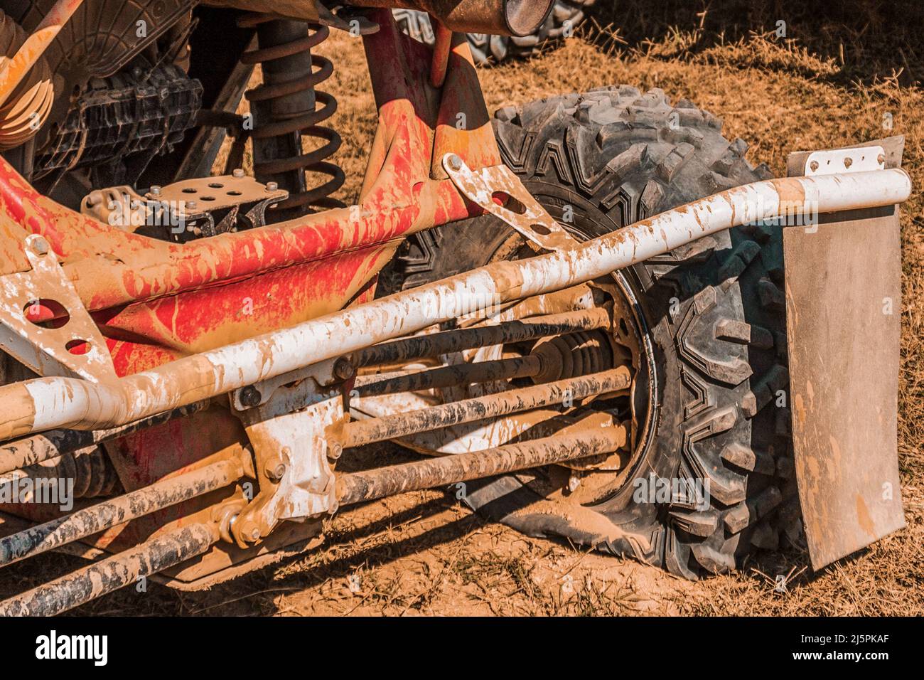 High angle view of an utv vehicle with a puncture on the right rear ...