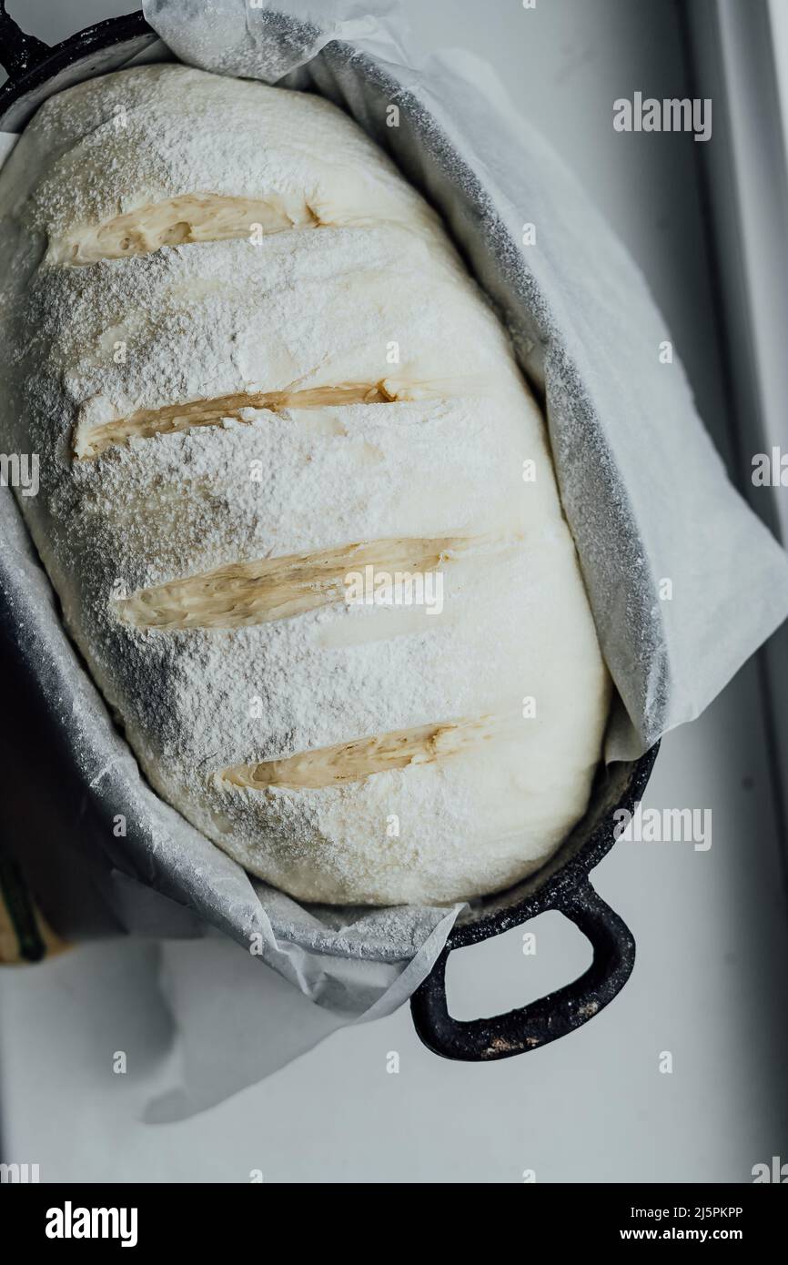 Raw bread dough in the mold ready for baking Stock Photo - Alamy
