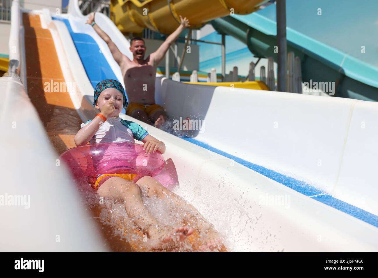 Sliding down waterslide hi-res stock photography and images - Alamy