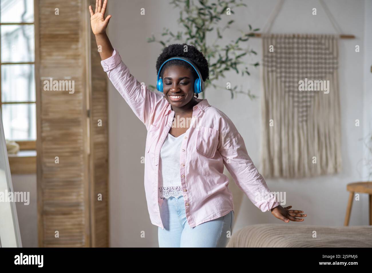 Young joyful woman dancing in hi-res stock photography and images - Alamy