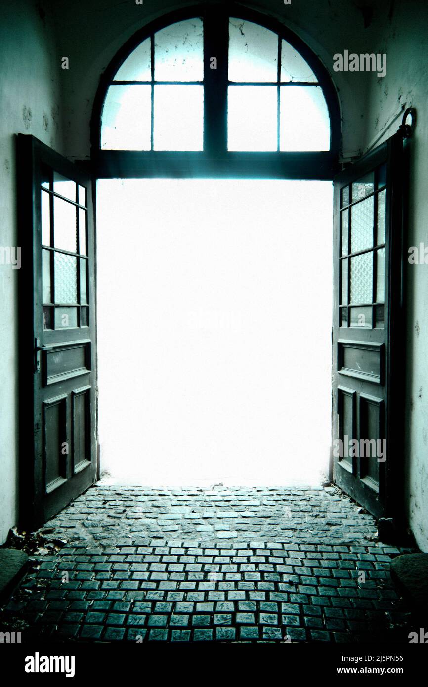 open double door and bright lights outside Stock Photo - Alamy