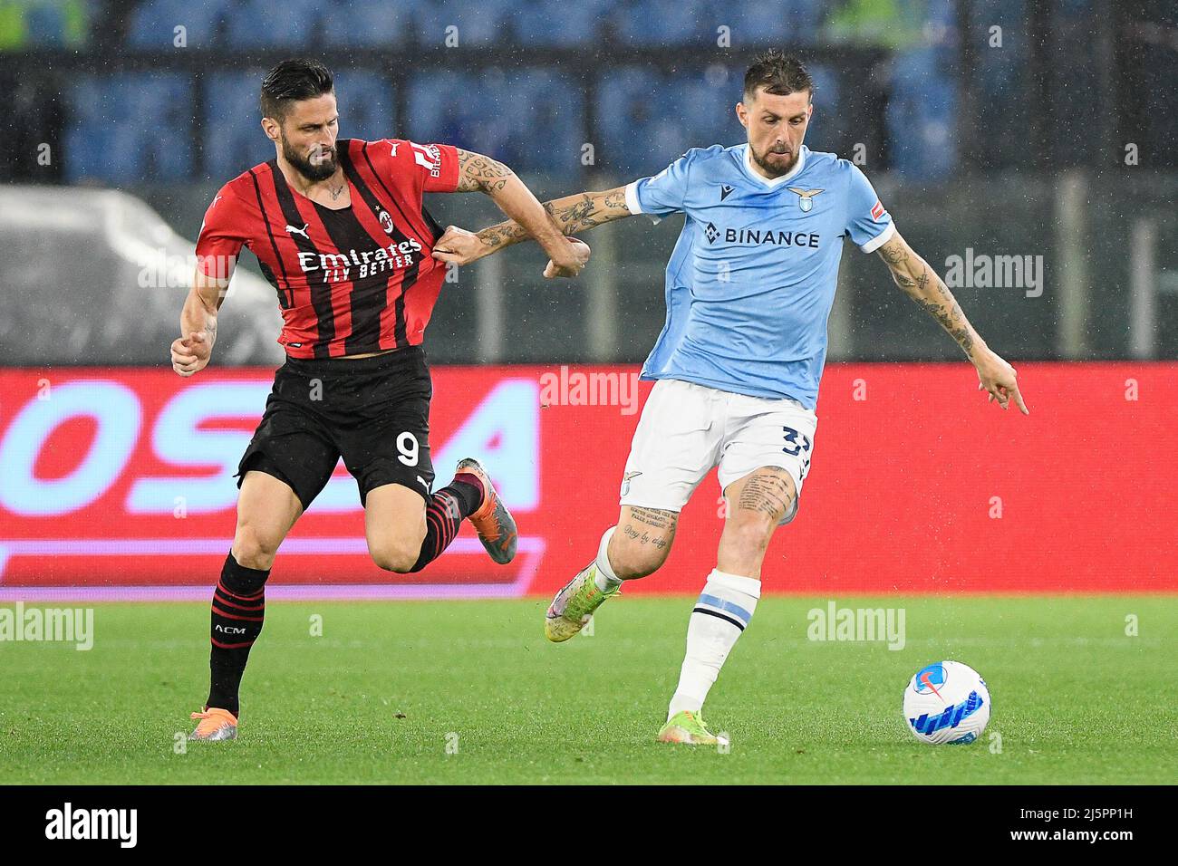 Rome, Italy. 24th Apr, 2022. Olivier Giroud of AC Milan and Francesco Acerbi of SS Lazio during ...