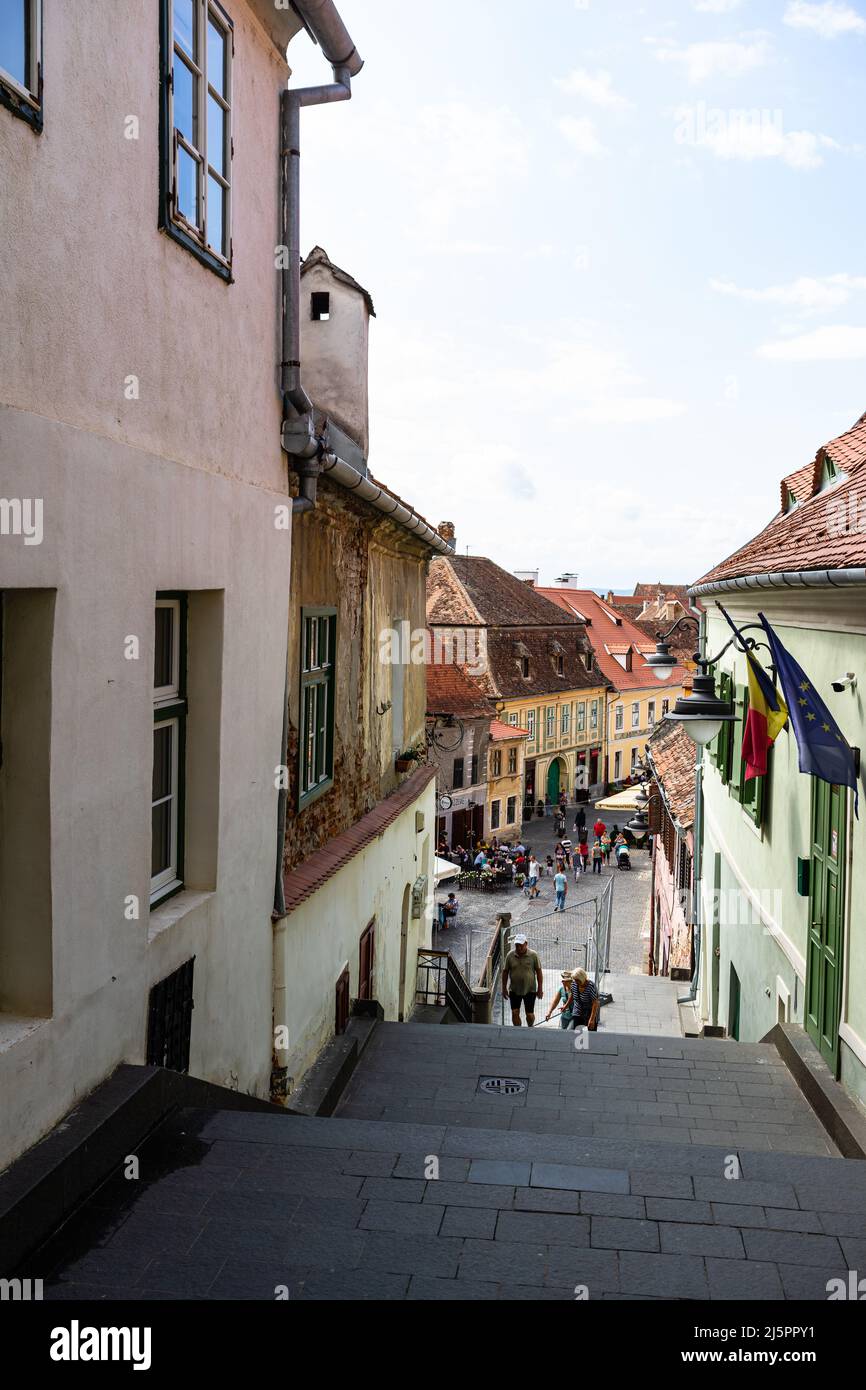 People and tourists wandering on the streets of old town Sibiu, Romania ...