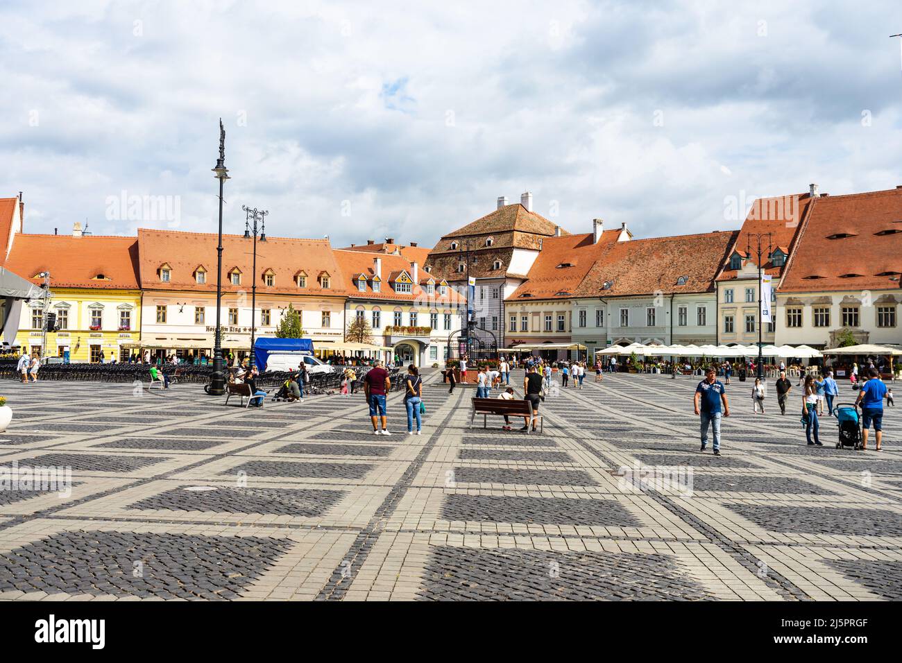 People and tourists wandering on the streets of old town Sibiu, Romania ...