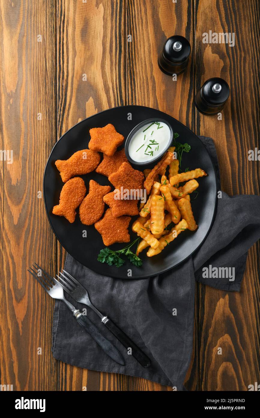 Fish and Chips british fast food. Fish Sticks with french fries set on ...
