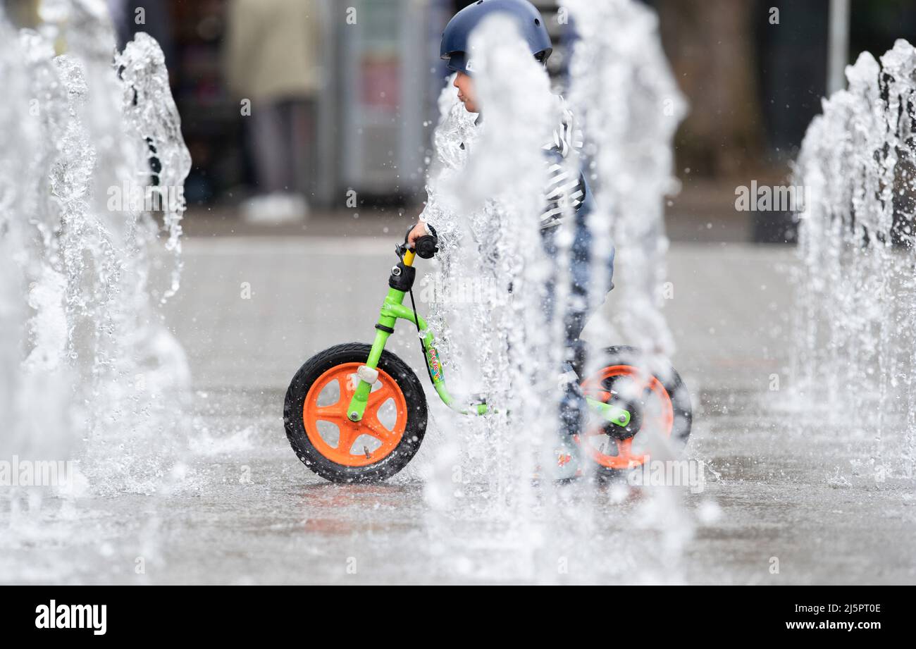 Bielefeld, Germany. 25th Apr, 2022. A child rides his running wheel ...
