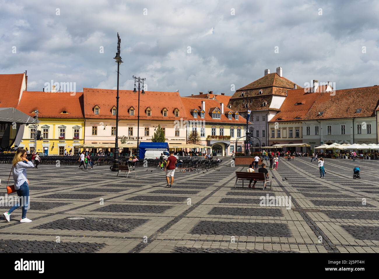 People and tourists wandering on the streets of old town Sibiu, Romania ...