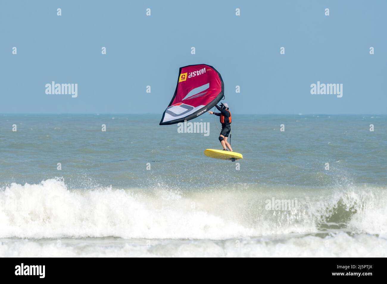 A wing surfer on a hydrofoil board winging in the Gulf of Mexico in ...