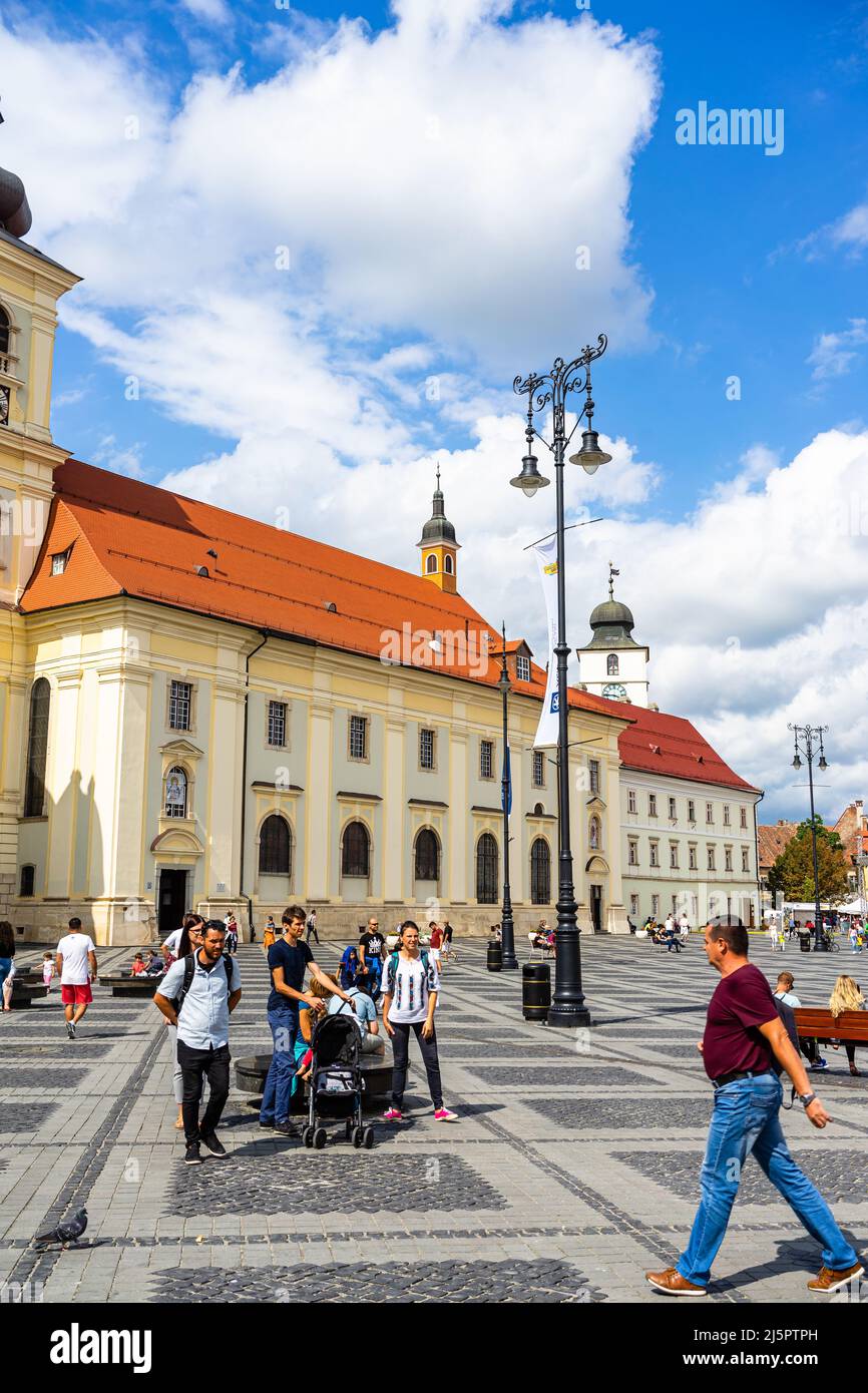 People and tourists wandering on the streets of old town Sibiu, Romania ...