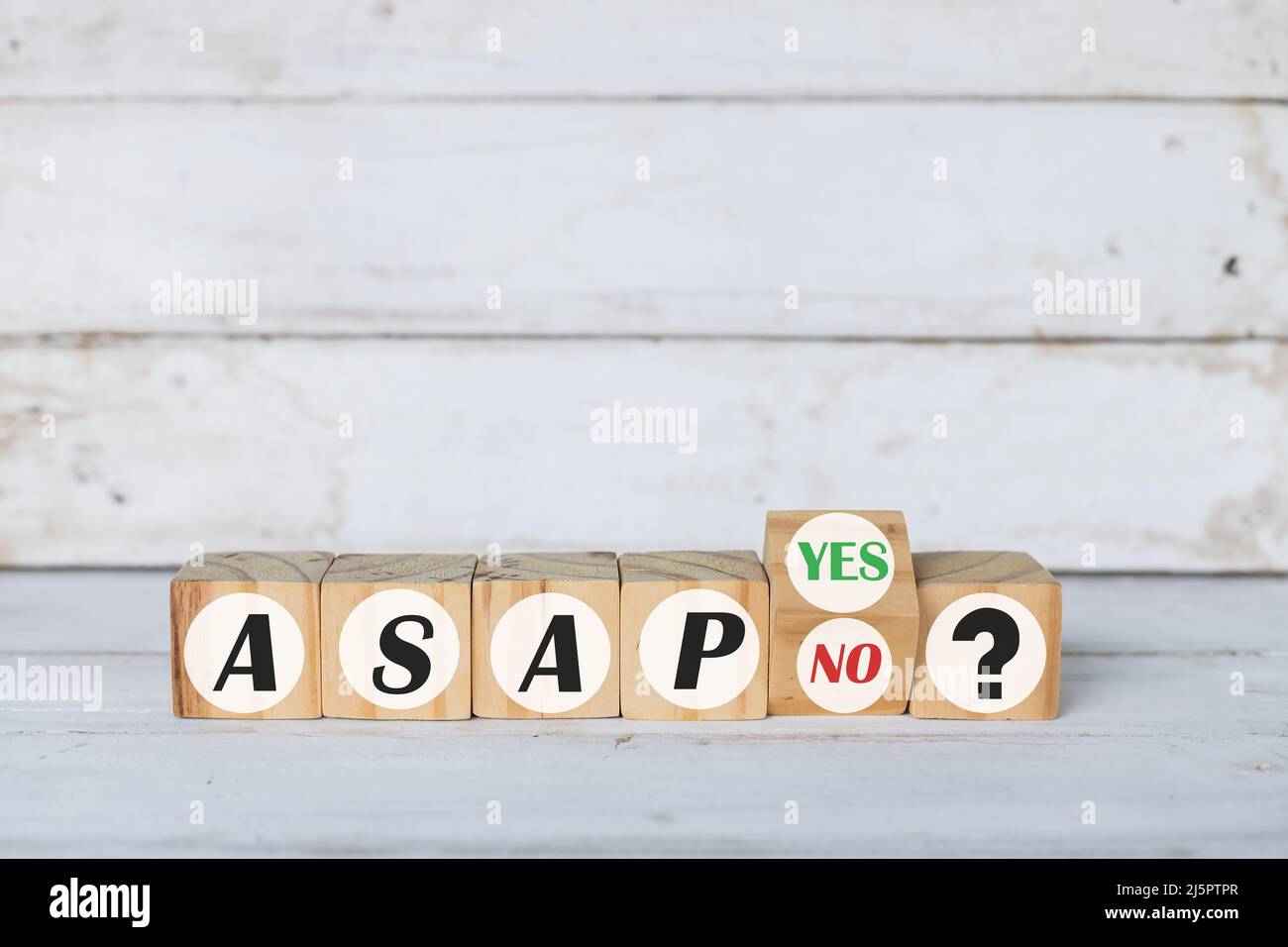 ASAP word written on wooden building blocks, white wood background ...