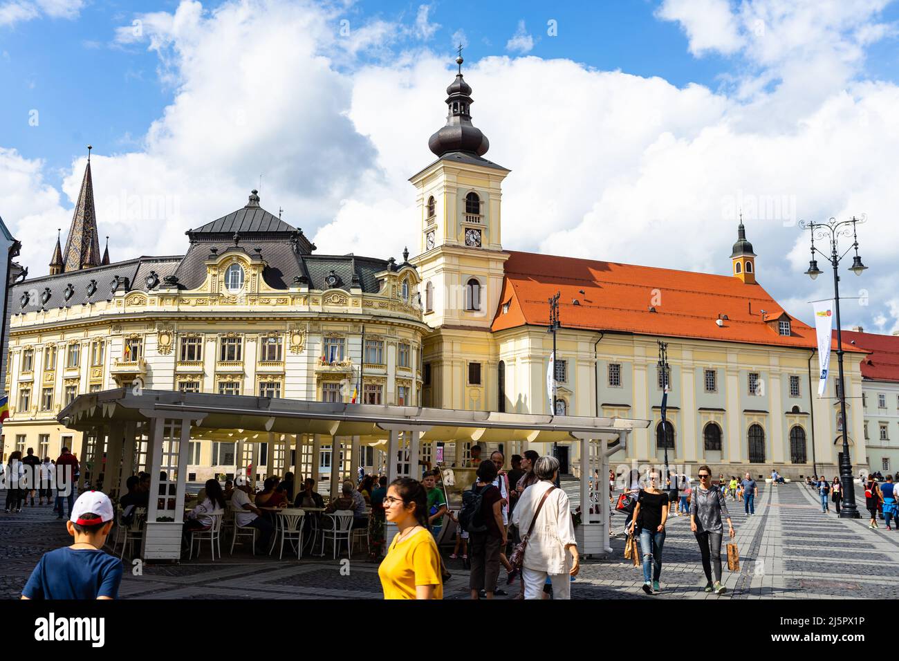 People and tourists wandering on the streets of old town Sibiu, Romania ...