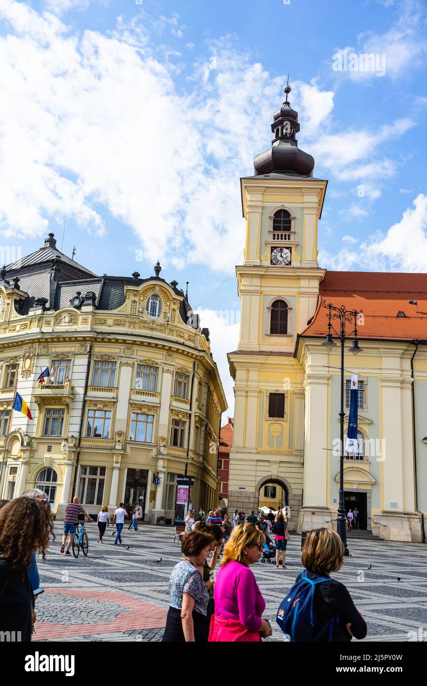 People and tourists wandering on the streets of old town Sibiu, Romania ...