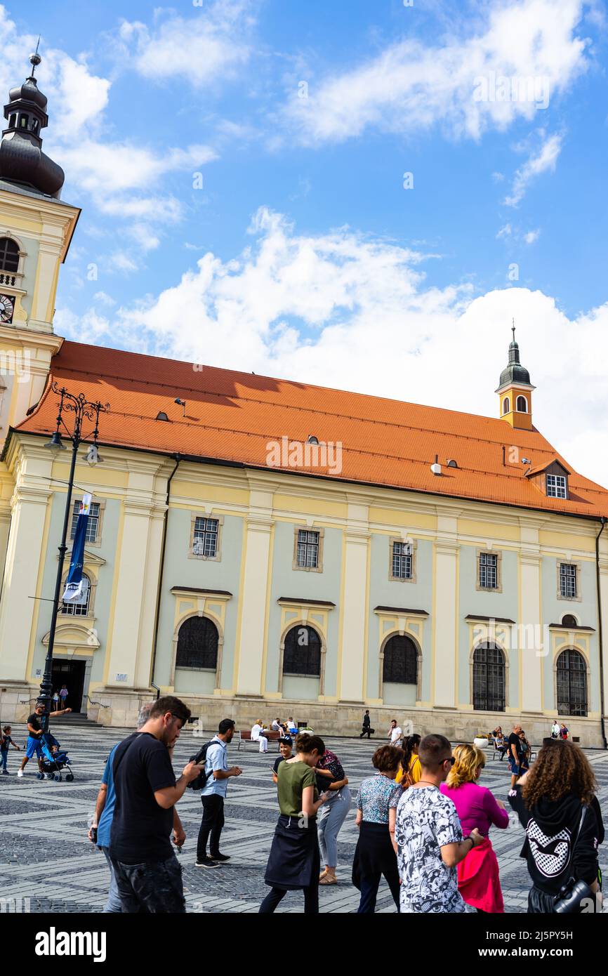 People and tourists wandering on the streets of old town Sibiu, Romania ...