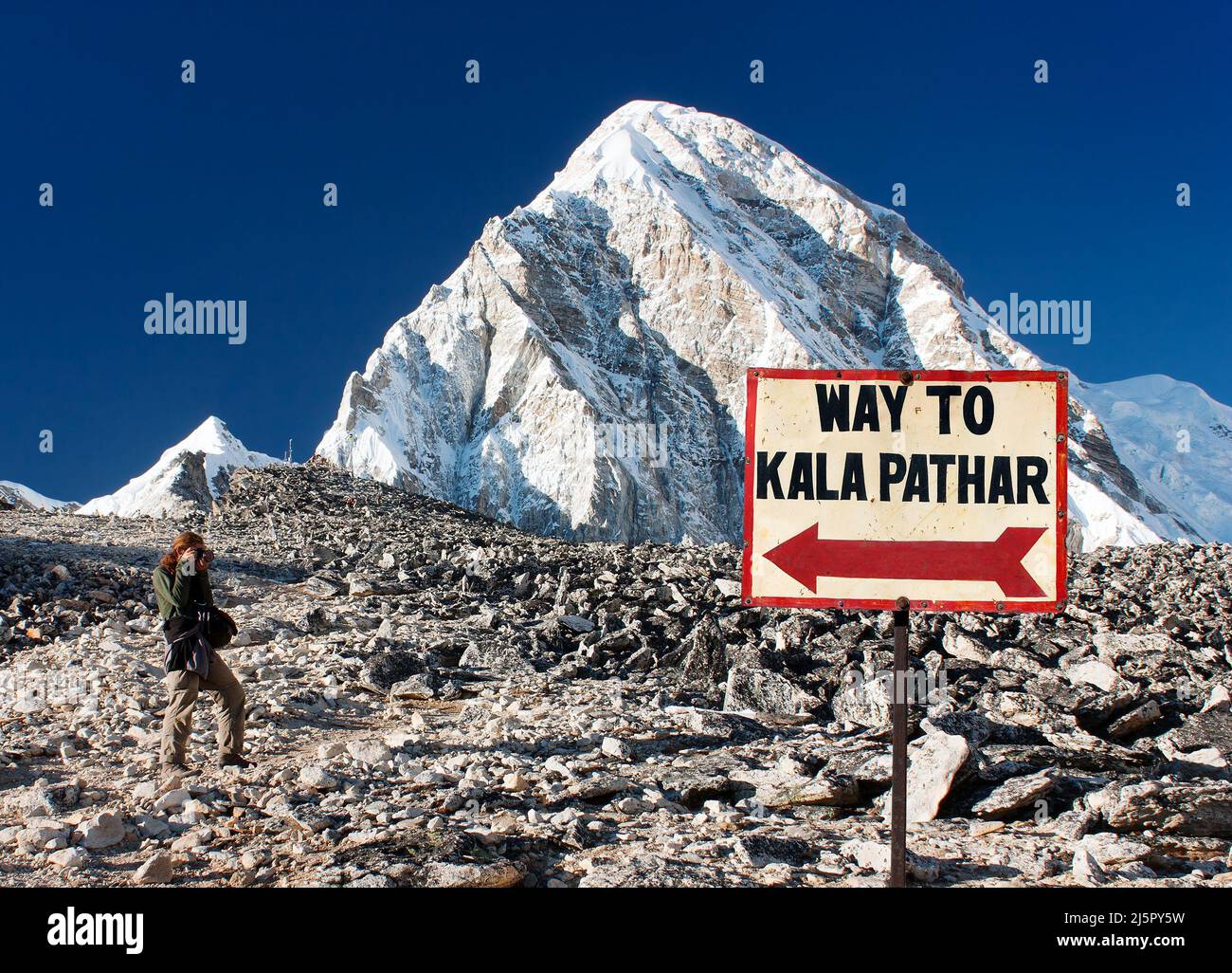 view of Kala Patthar and mount Pumori - signpost way to Kala Patthar ...