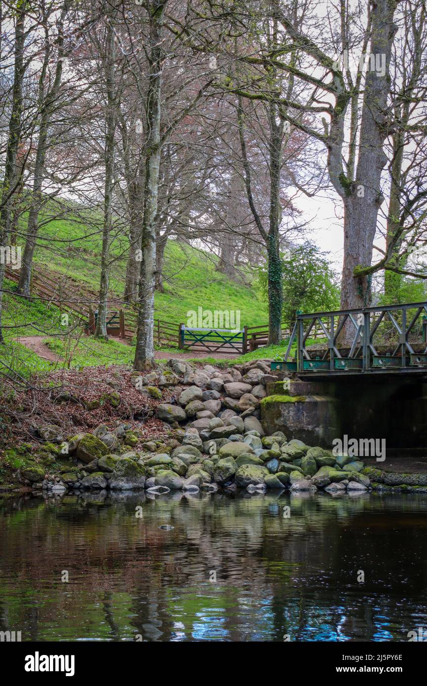 Bridge over the River Lowther, Lowther Estate. Rocks and river bank ...
