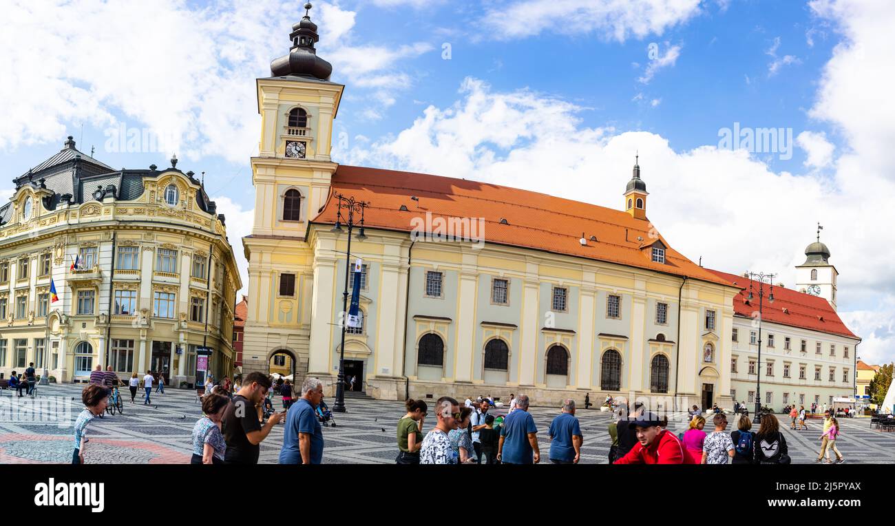 People and tourists wandering on the streets of old town Sibiu, Romania ...